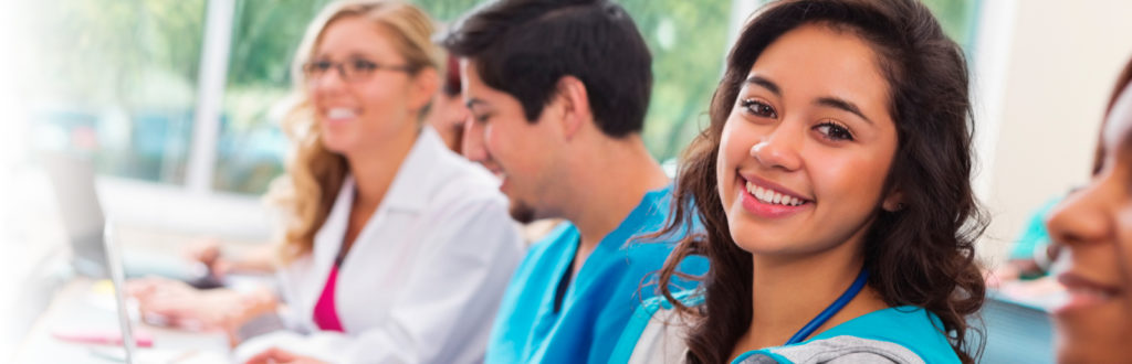 Smiling woman with long brown hair. | eei